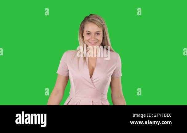 Pretty woman showing her dress to the camera on a Green Screen, Chroma ...