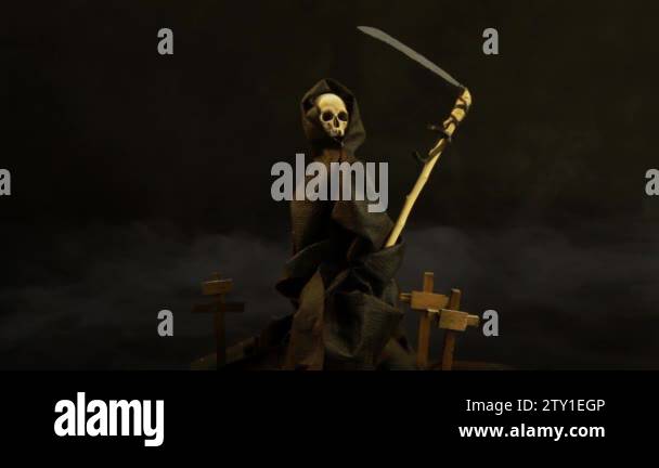 Conditional symbol of death in dark mantle with hood on dark background ...