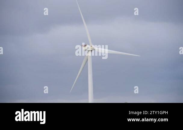 Energy wing power turbine rotates on sunset sky background. Full HD ...