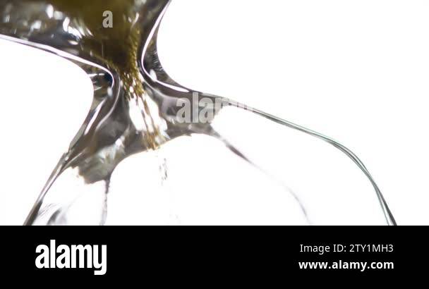 Golden Sand is poured into the lower part of the hourglass with a thin ...