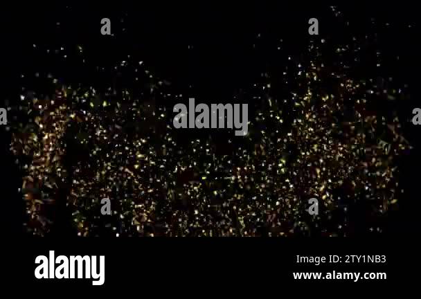 Golden Confetti Party Popper Explosions on a Black and Green ...