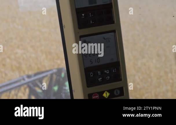 Modern harvesting tractor controlling panel close up in the cab. View ...