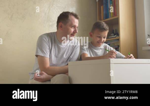 Man helping boy Stock Videos & Footage - HD and 4K Video Clips - Alamy