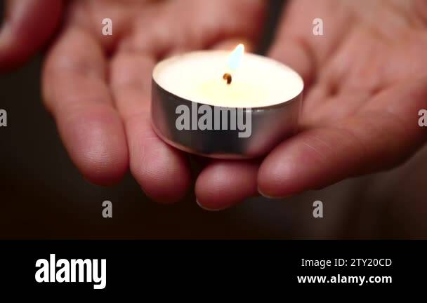 Candle in hands. Sorrow for deliberate termination of a human pregnancy ...