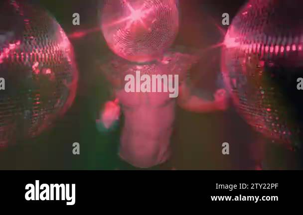 Muscular man dancing with disco ball on head Stock Video Footage - Alamy