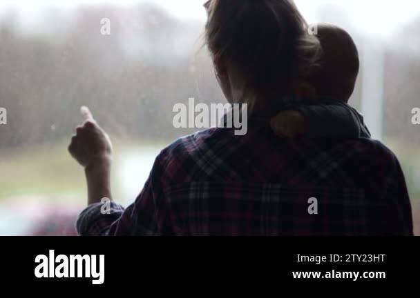 Figures of the mother and child opposite the window. A woman shows the ...