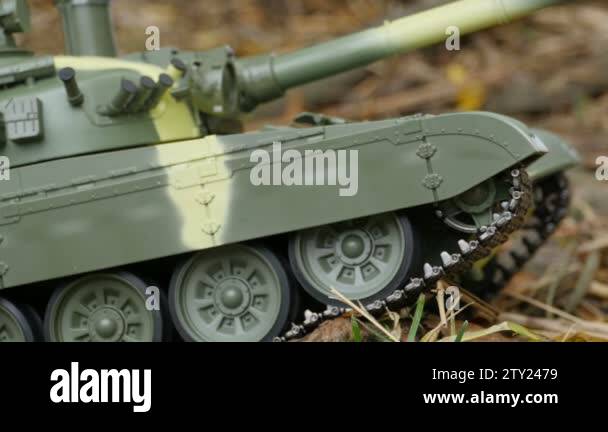 iron caterpillars of a battle tank in a combat position, camera in ...
