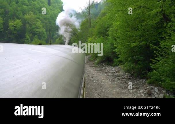 view from the roof of a retro train wagon, Old steam locomotive in ...