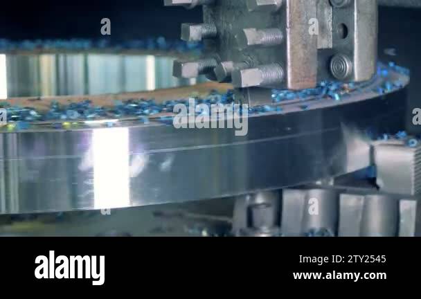 Metal grinder makes lines on a disk. Metalworking CNC milling machine ...