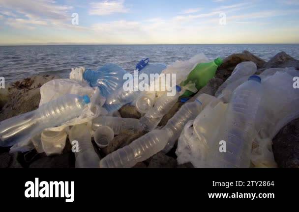 Plastic pollution in ocean environmental problem. Plastic cups,carrier ...