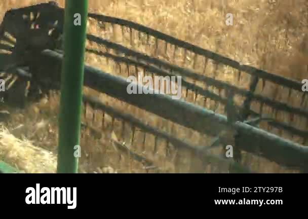 a close up of the reciprocating knife cutter bar of a combine harvester ...