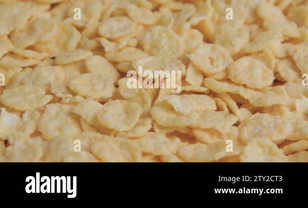 Rotation of crispy yellow corn flakes Stock Video Footage - Alamy