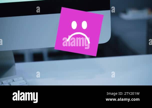 Sad smile. Sad face painted on a sticker on the monitor. Message ...