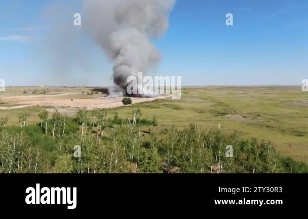 Burning trash. fire at the landfill. Burning garbage. Garbage dump, top ...
