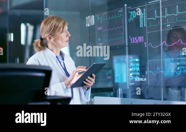 Male Athlete Runs on a Treadmill with Electrodes Attached to His Body ...