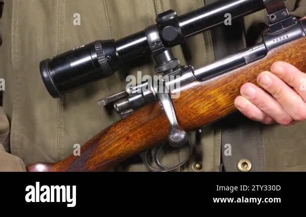 Reloading a bolt action rifle Stock Video Footage - Alamy