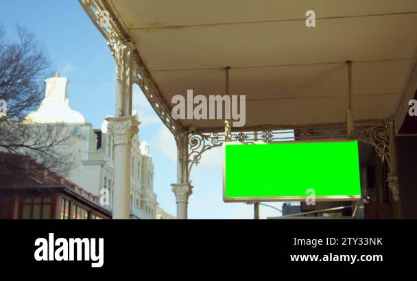Led hoarding under the roof of building. Green screen display on the ...