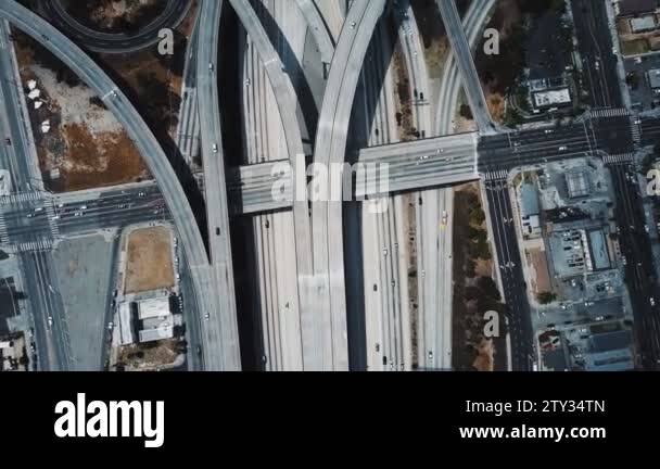 beautiful drone flyover above large highway junction interchange with ...