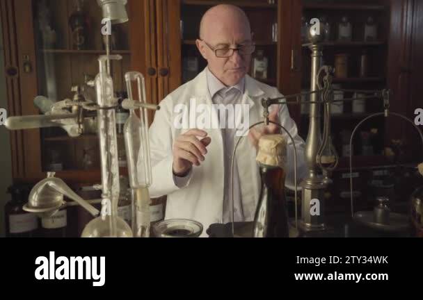 Portrait of handsome senior Caucasian man checking old-fashioned ...