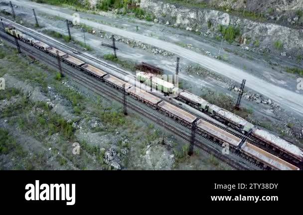 Open-pit mine, mining train carrying excavated materials at the ...