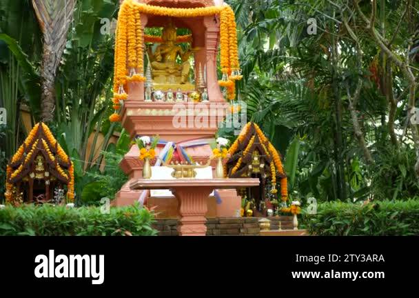 Wooden miniature guardian spirit house. Small buddhist temple shrine ...