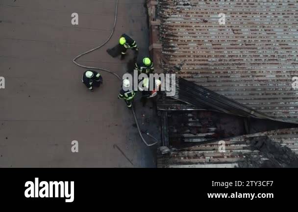 big fire and fog smoke fireman shooting from a height flying sky drone ...
