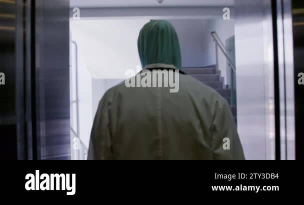 Rear view of a mixed race female doctor wearing a lab coat, stethoscope ...