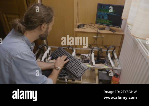 Cryptocurrency specialist encrypting system information typing code and ...