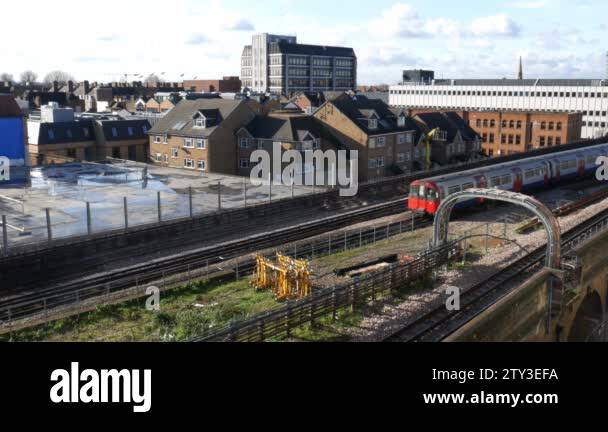 High perspective view of London Underground trains carrying passengers ...