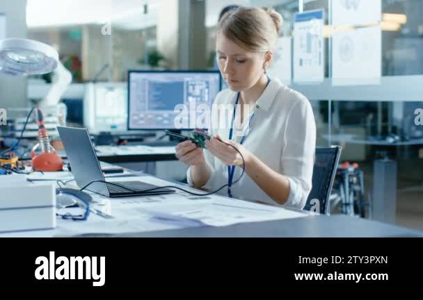 Female Computer Scientists Connects Circuit Board to Her Laptop and ...