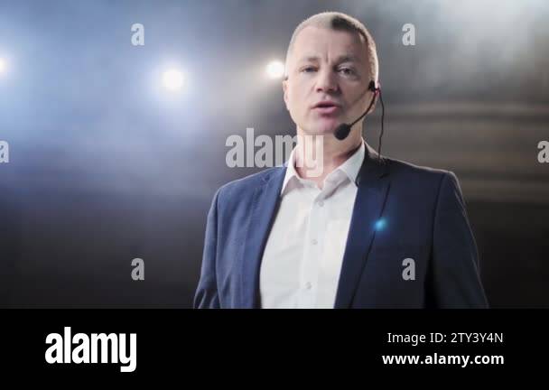 Showman. Middle Age Male entertainer, presenter or actor on stage. Arms ...