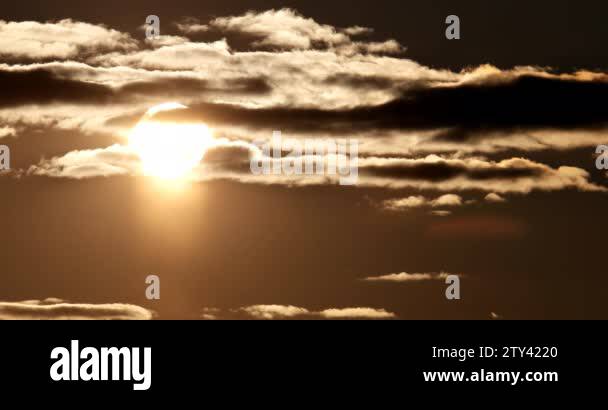 The sun is behind the clouds. Light pole down. Video. UltraHD (4K Stock ...