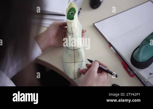 Modelling design of a shoes. Workplace of shoe designer. Hands of ...