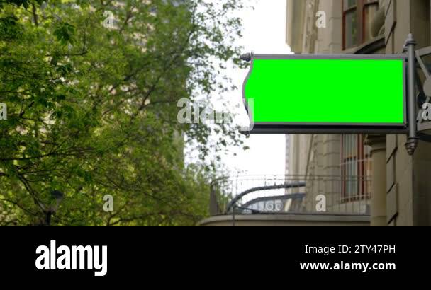 Led hoarding on the exterior of the building in city. Green screen ...