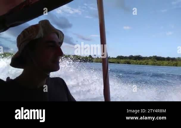 Man travelling by sea on boat, water drops falling on him. Extreme ...
