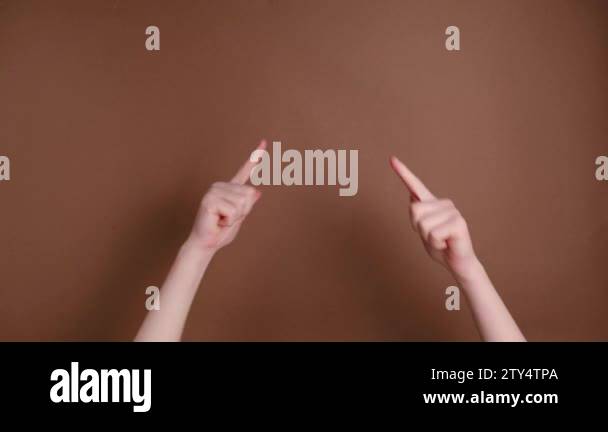 Closeup side view of unrecognizable female shows an ok sign with both ...