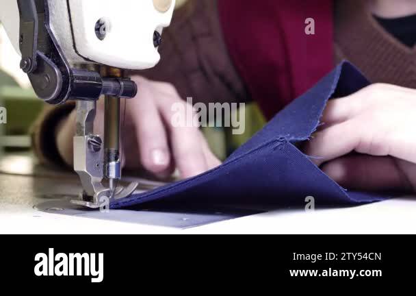 Work for the Sewing Machine / Worker for sewing machine sew parts of ...