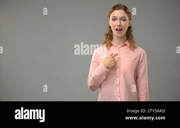 Lady saying i understand in sign language, teacher showing words in asl ...