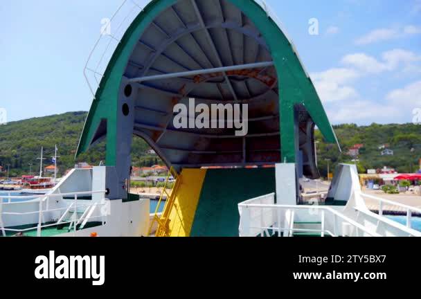 Lifted door at front side of ferry boats loading ramp while leaving ...
