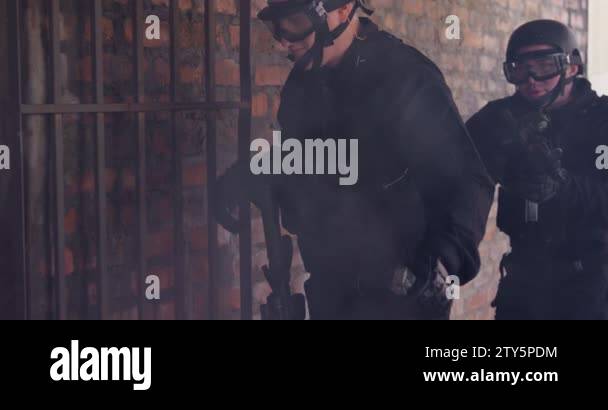 Side view of caucasian military soldier throwing smoke grenade on ...