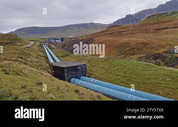 The Storr Lochs hydroelectric power station nestled under the mountains ...