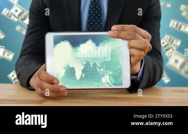 Businessman holding digital tablet showing animated world against ...