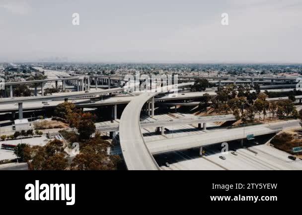drone flying around amazing highway junction interchange in los angeles ...