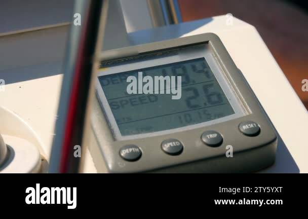 Closeup on navigating instruments behind steering wheel of sailing boat ...