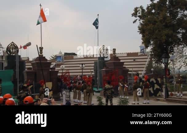 Border guards lower flags at the military ceremony at India-Pakistan ...
