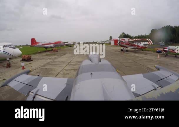 A gray blue fighter combat aircraft ride along the runway at the old ...