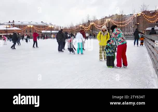 St.Petersburg Russia - 01jan2019: A crowd of people skating on the ice ...