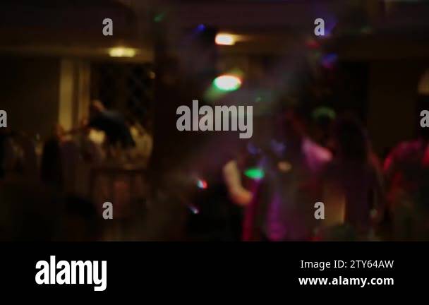 Blurred footage of crazy crowded party with people dancing on the ...