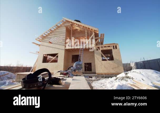 unfinished frame house interior with wooden beams of roof and walls ...