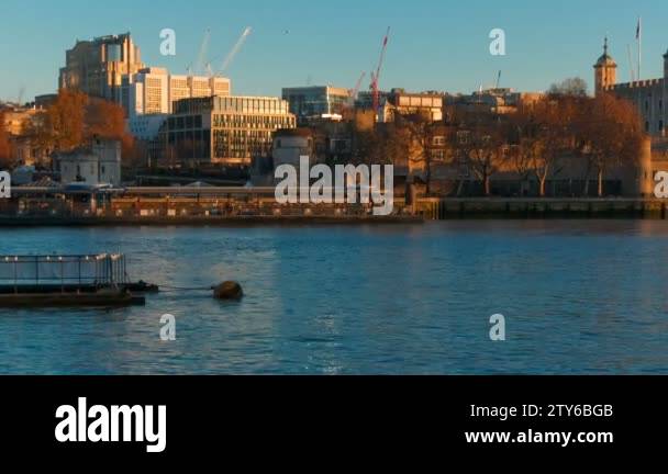 Panning golden hour sunsrise shot of the Tower of London and Tower ...